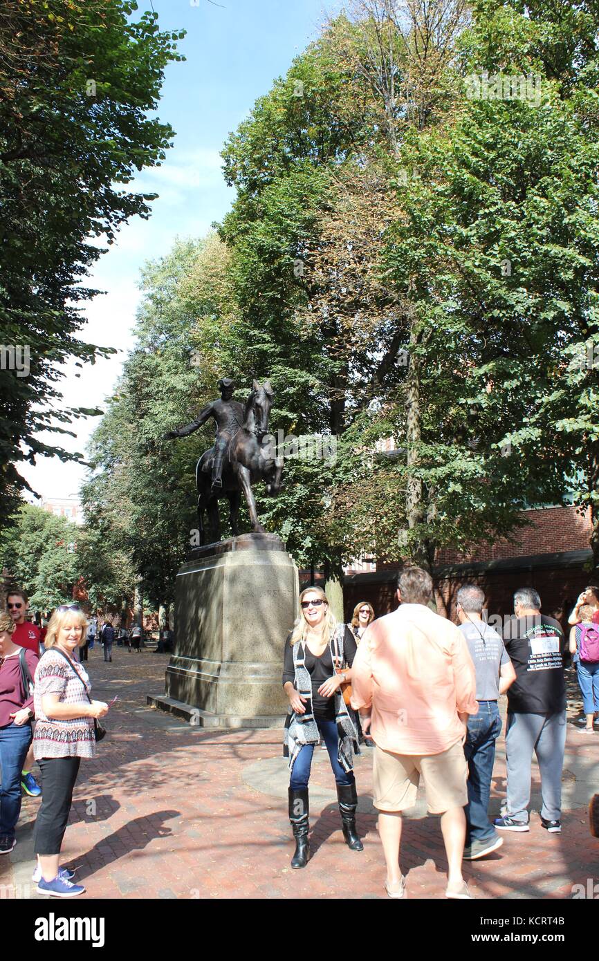 A lady laughs and is having a good time on the busy streets of Boston ...