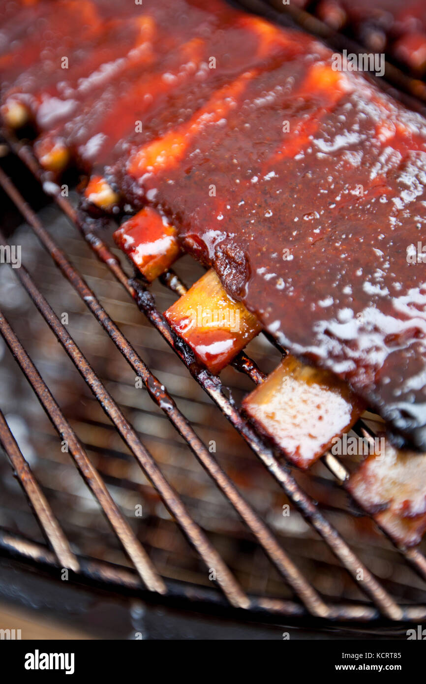 BBQ pork ribs cooking on a smoker Stock Photo - Alamy