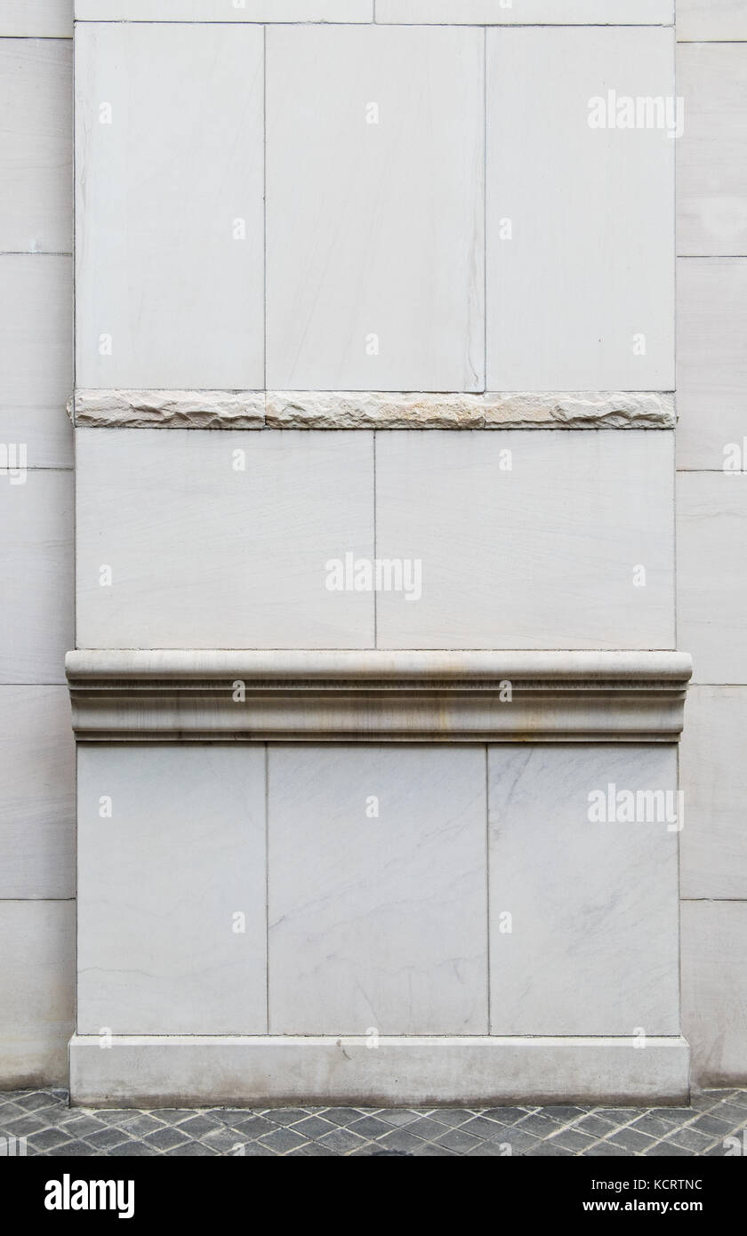 Front elevation view of classic stone column base detail and wall ...