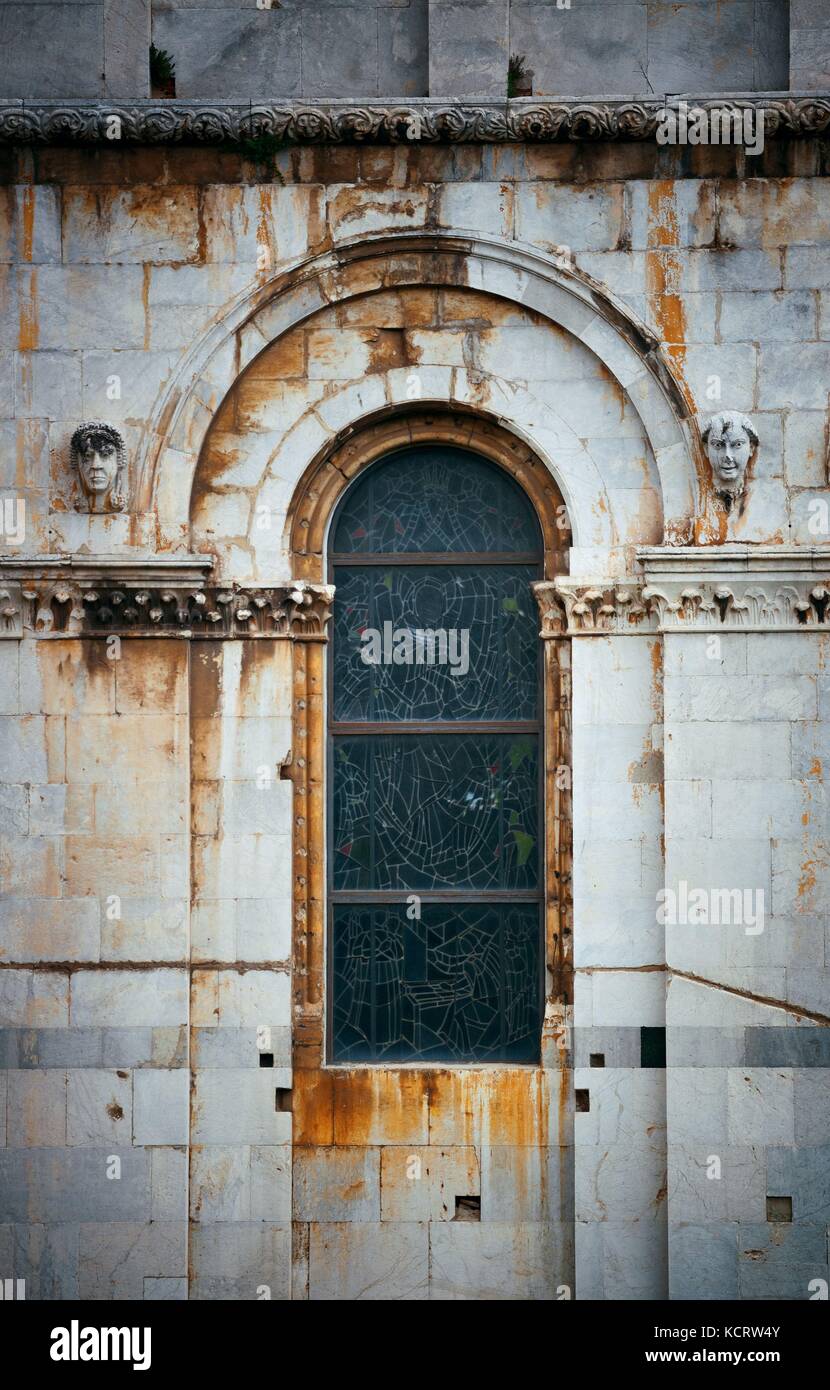 Vintage window with arch shape and sculpture closeup in medieval Town ...