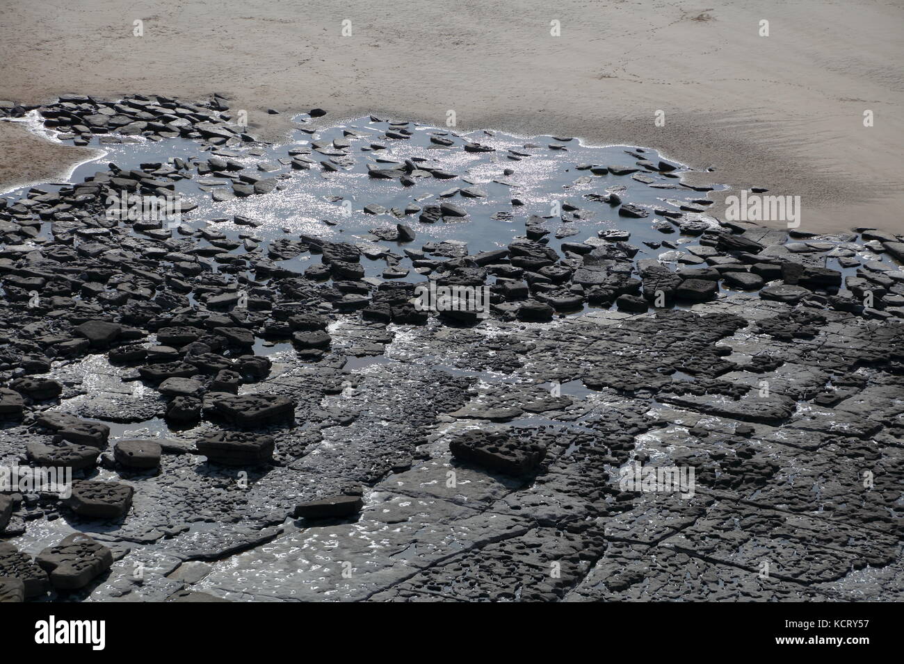 Looking down onto Dunraven Bay beach with its distinct black rocos ...