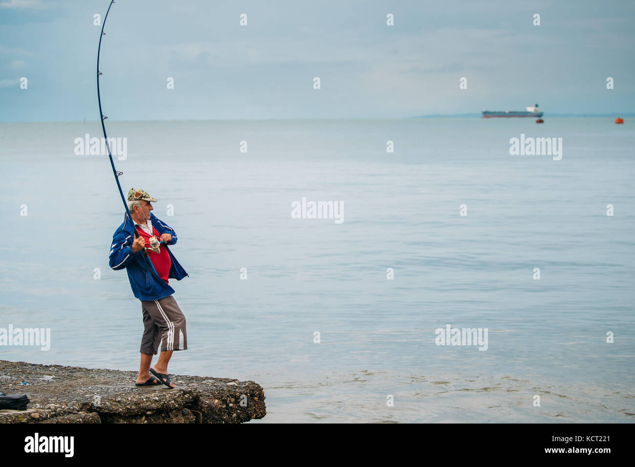 Old man fishing hi-res stock photography and images - Alamy