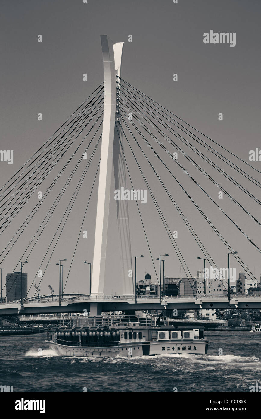 TOKYO, JAPAN - MAY 15: Bridge and boat in river on May 15, 2013 in ...