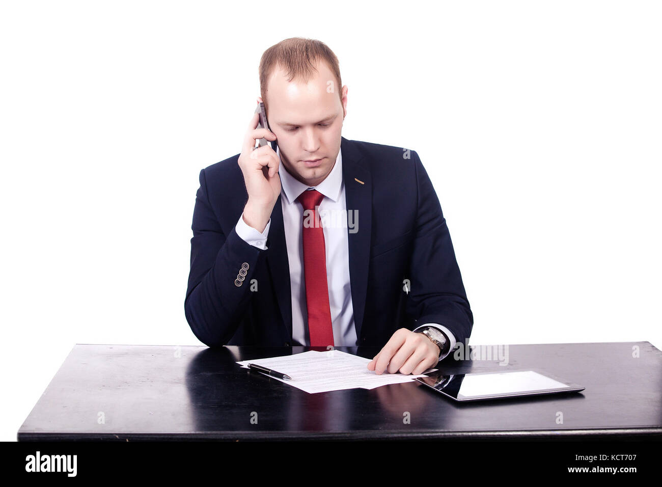 teacher is speaking by phone while working with documents Stock Photo ...