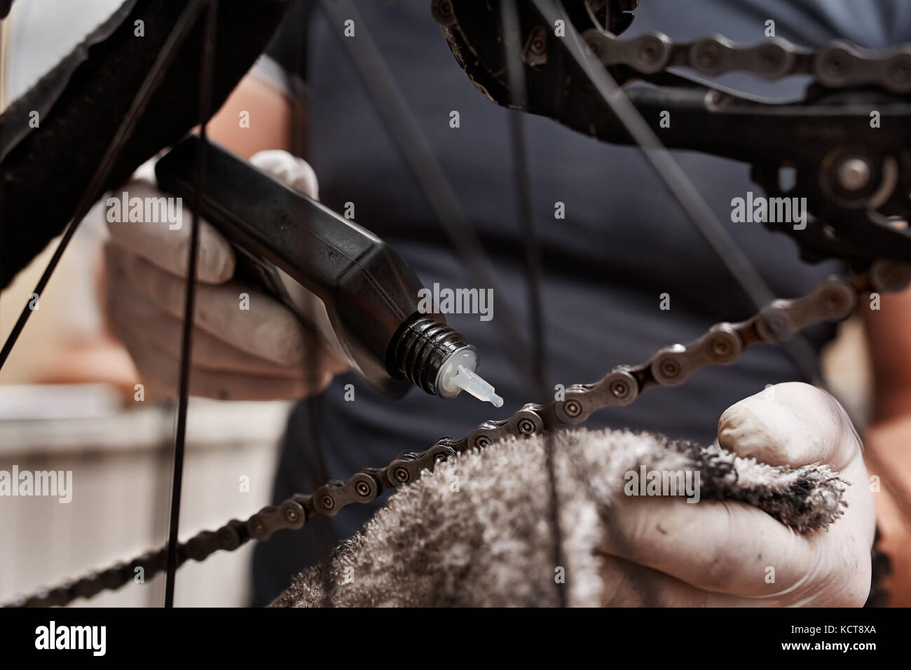 Closeup Cleaning and oiling a Bicycle chain and gear with oil Stock ...