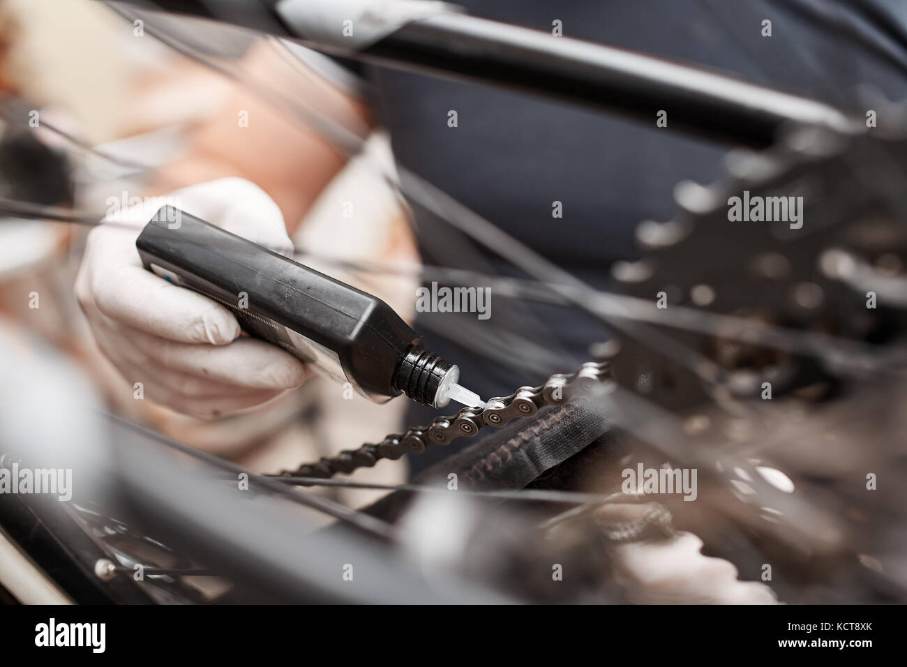 Male oiling bike hi-res stock photography and images - Alamy