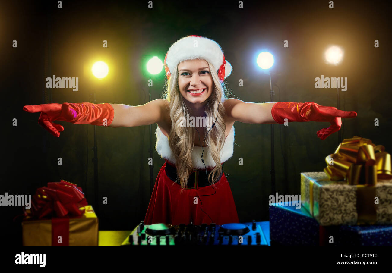 DJ girl in a santa hat for Christmas Stock Photo - Alamy