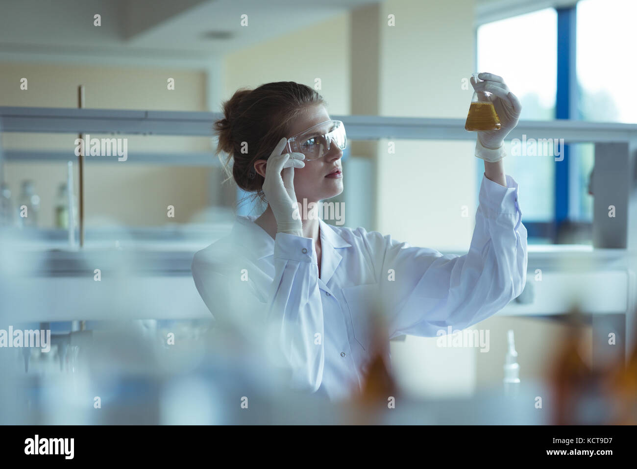 Student doing experiment in laboratory at Stock Photo - Alamy
