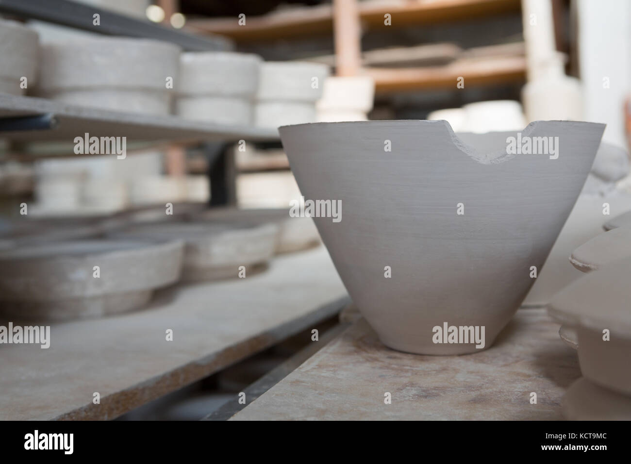 Earthen pots on a table in pottery workshop Stock Photo - Alamy