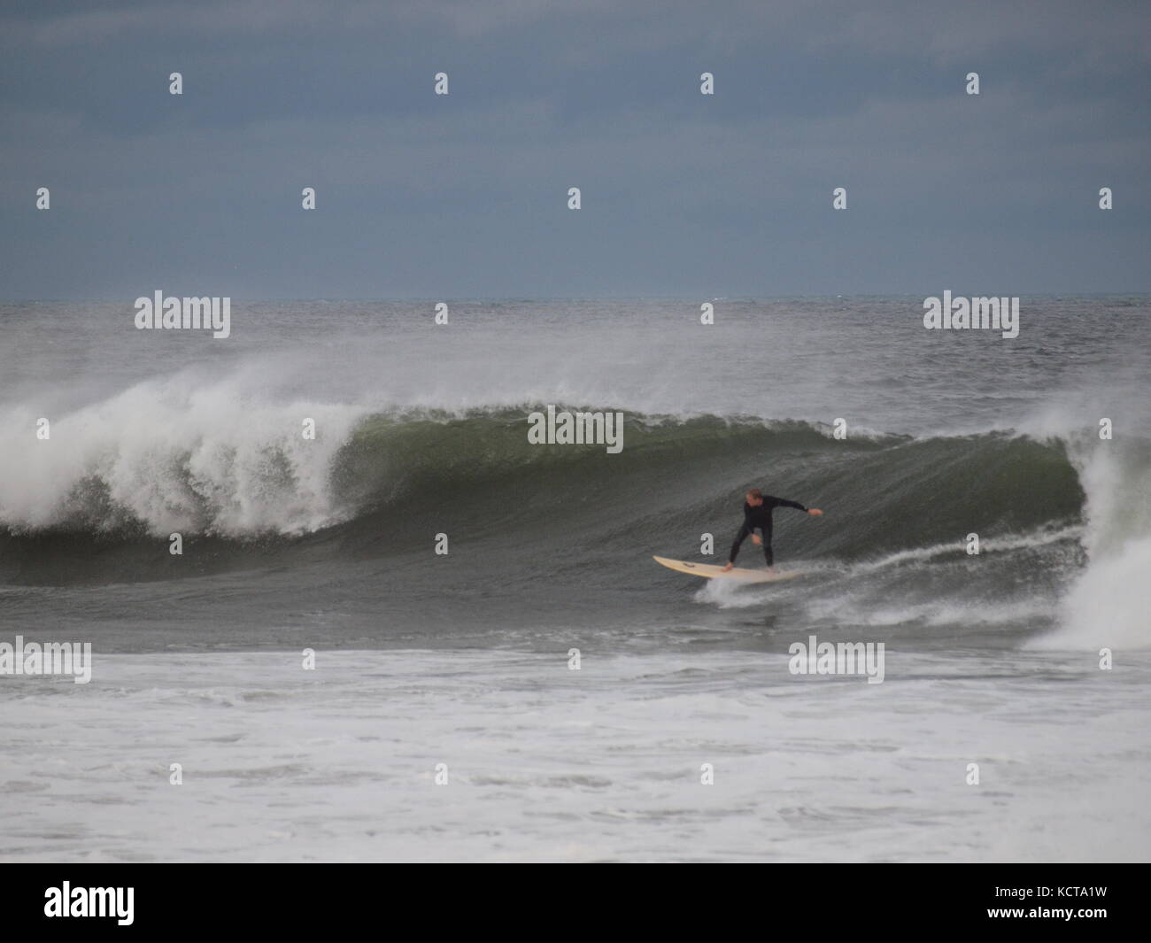 New Jersey surfer getting a big wave, Ocean Beach, NJ Stock Photo - Alamy