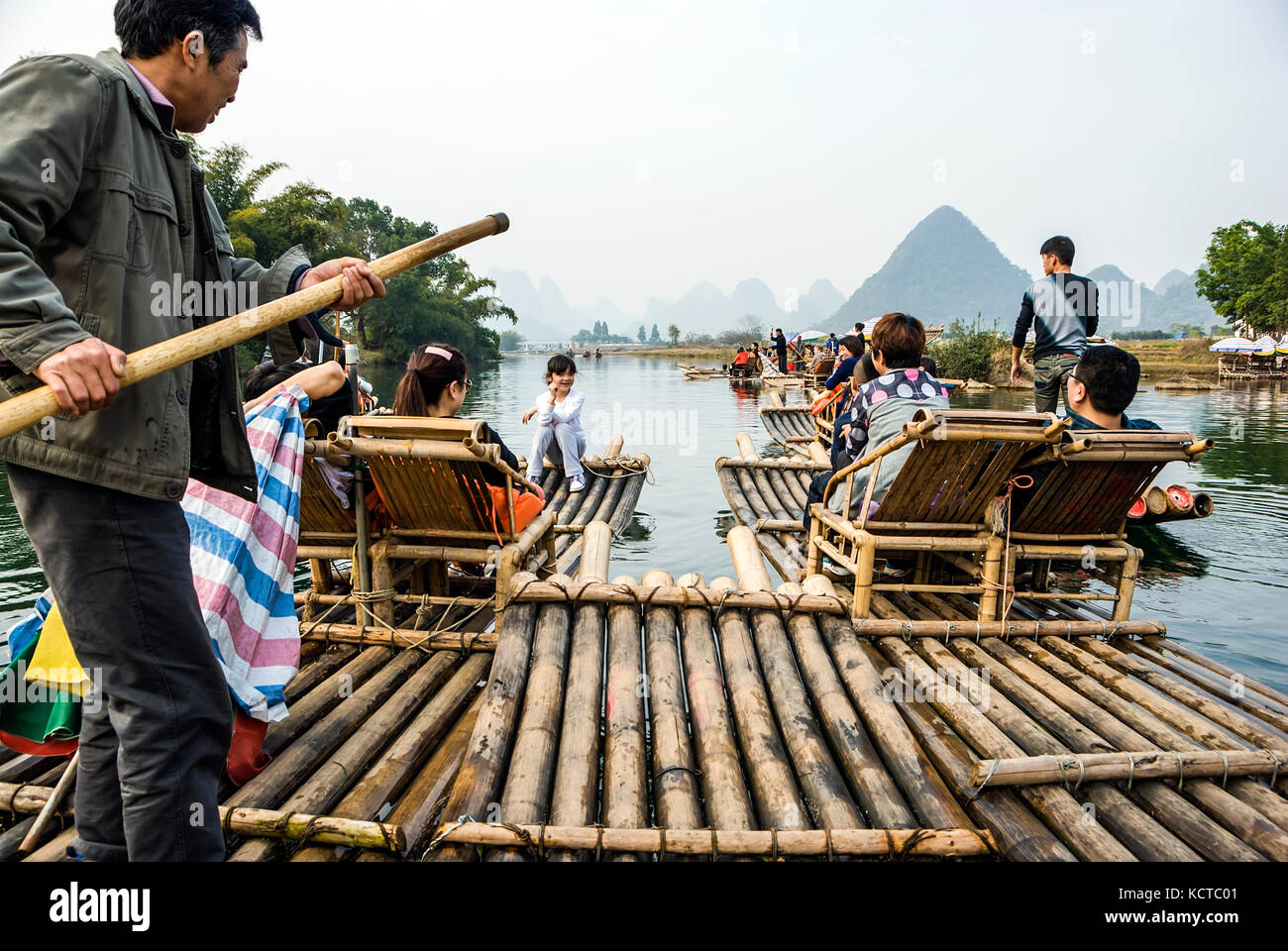 Bamboo raftign along YuLong, Guilin, China - Bamboo rafting along ...