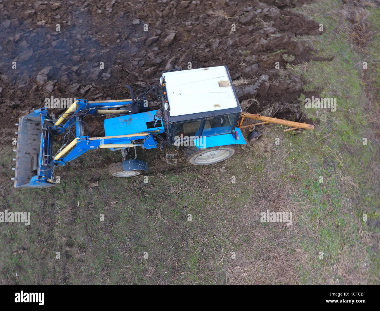 Tractor plowing the garden. Plowing the soil in the garden Stock Photo ...