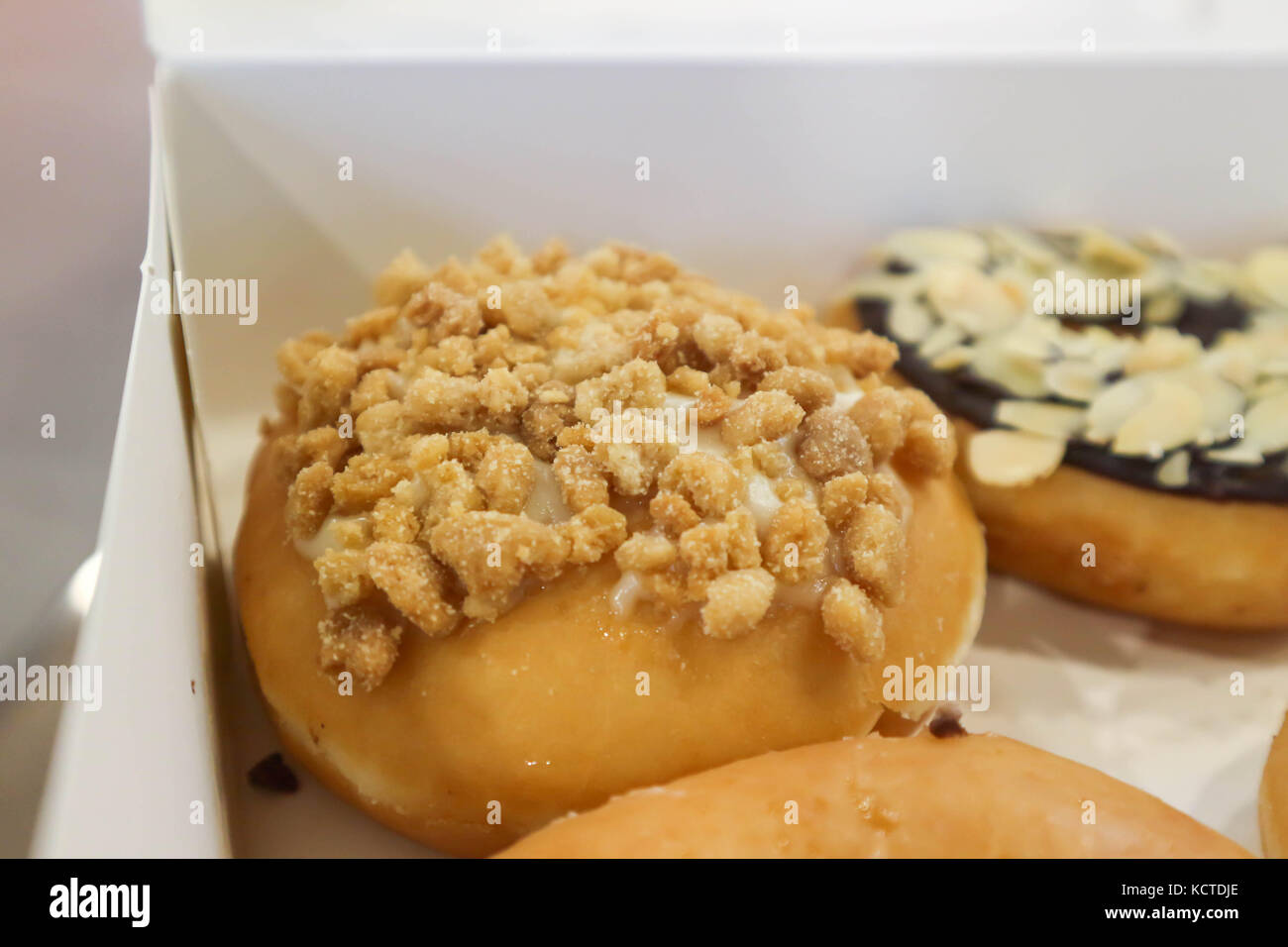 donut or doughnut with crumble topping Stock Photo - Alamy