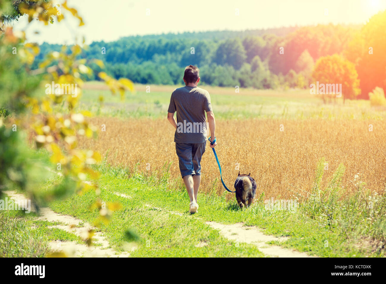 People walk along dirt road hi-res stock photography and images - Alamy