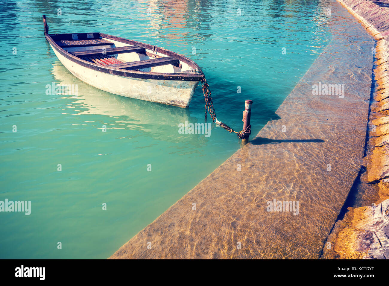 Landscape with lake and boat. Boat near pier Stock Photo - Alamy
