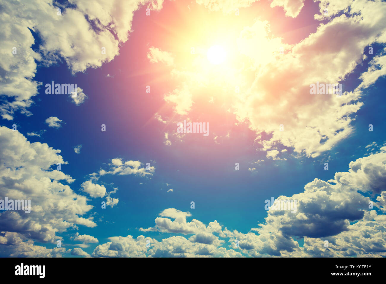 Cloudy sky with the sun Stock Photo - Alamy