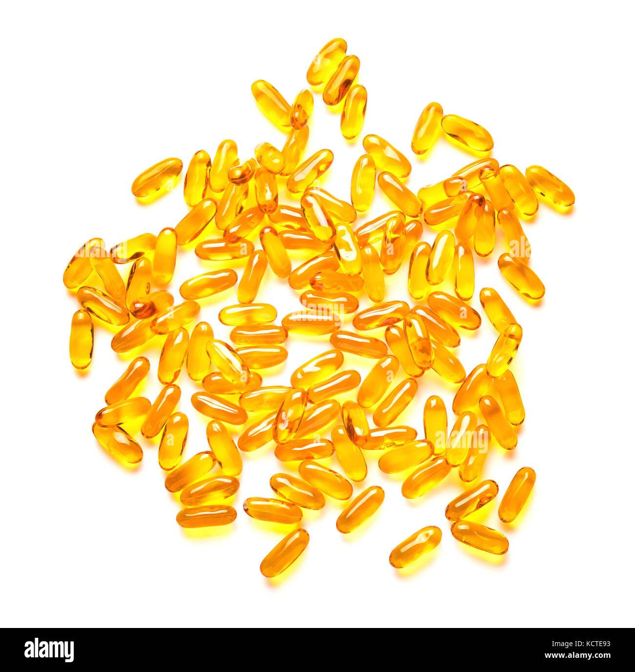top view studio shoot of translucent oil capsules on a white background ...