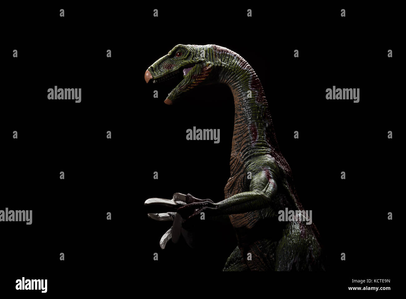 nothronychus toys upper part on a dark background Stock Photo - Alamy