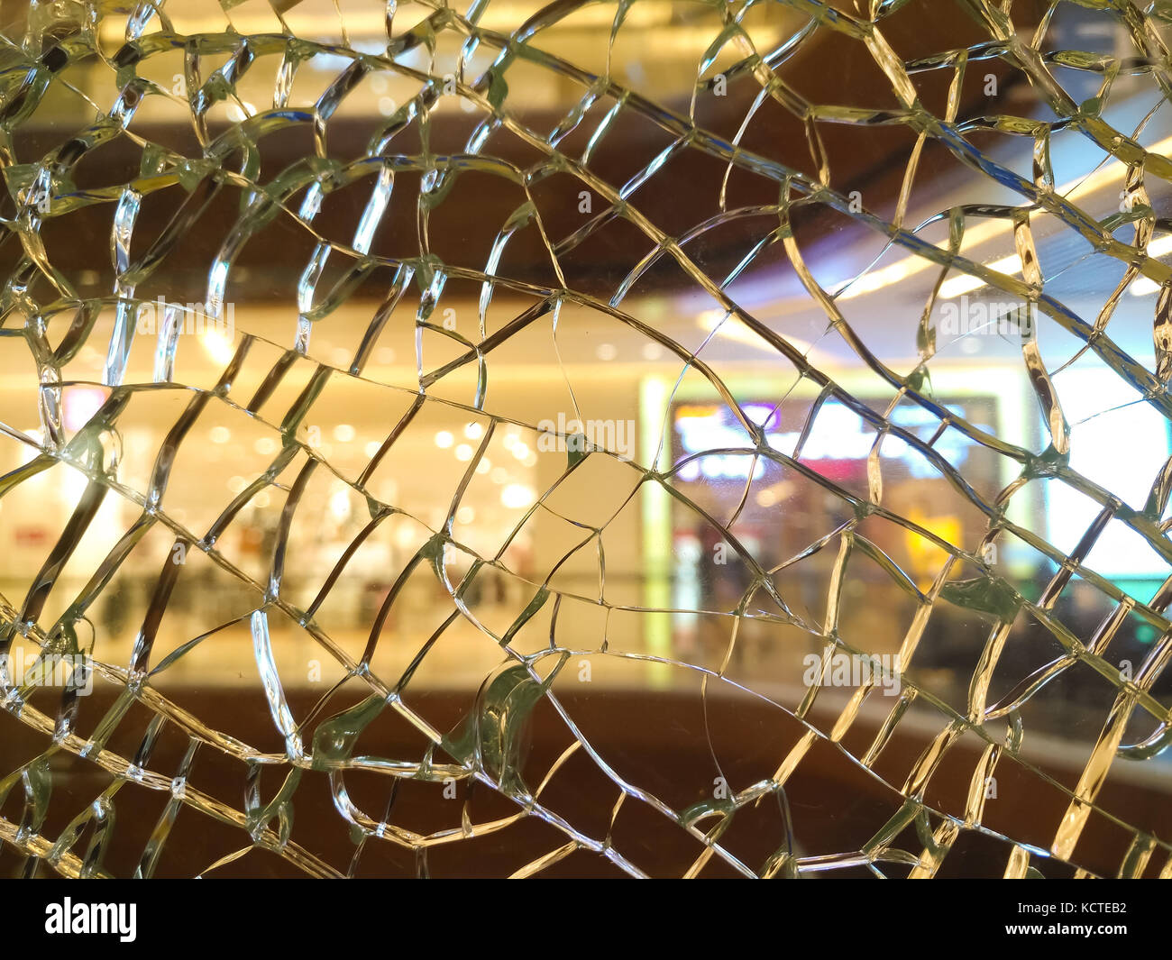 broken glass barrier in a morden shopping mall selective focus Stock ...