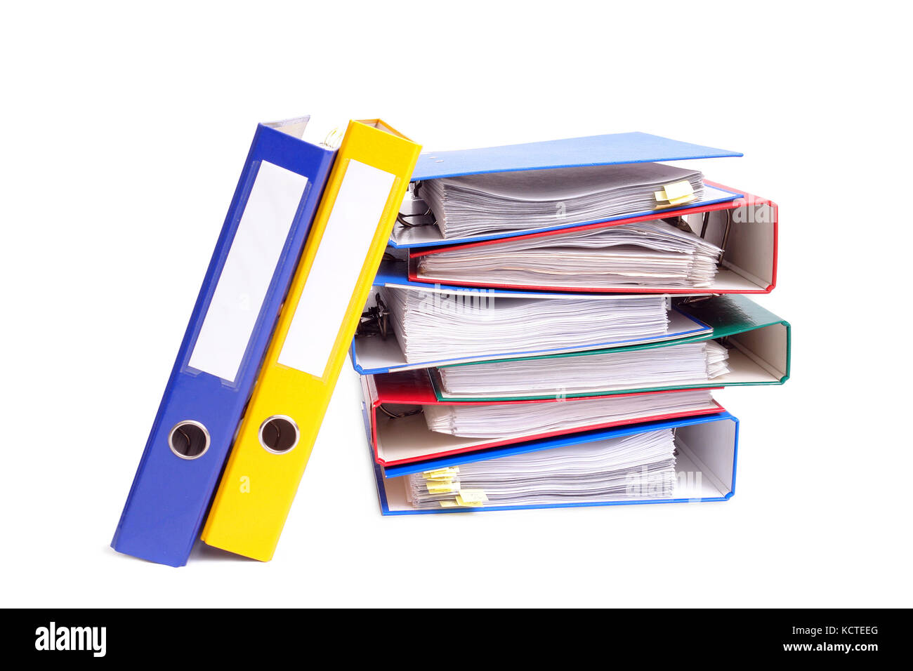 Pile of colorful ring binders over white background Stock Photo - Alamy