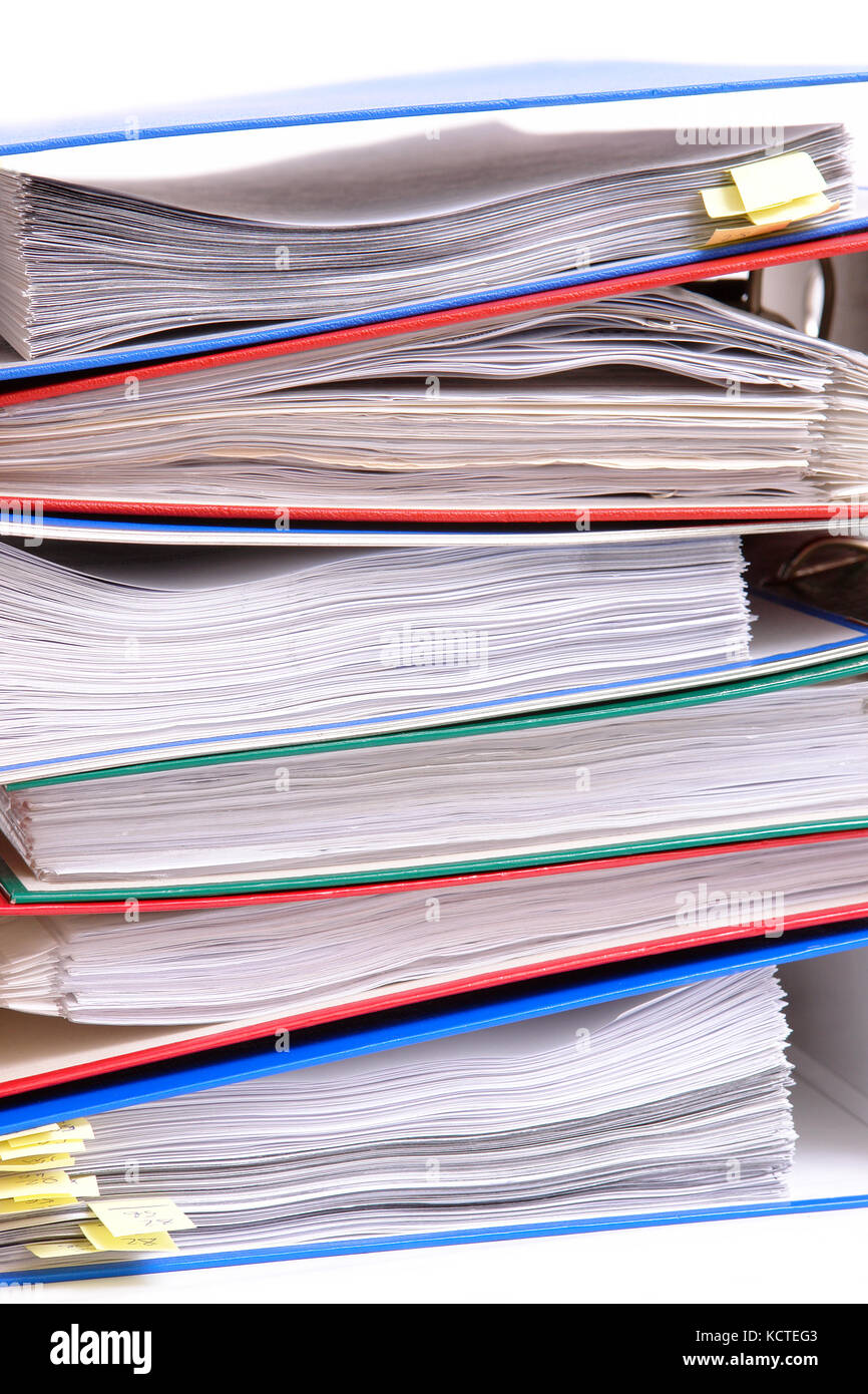 Pile of colorful ring binders over white background Stock Photo - Alamy