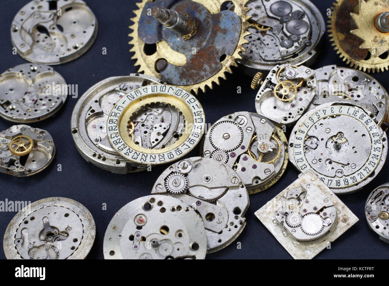 broken mechanical watches background Stock Photo - Alamy