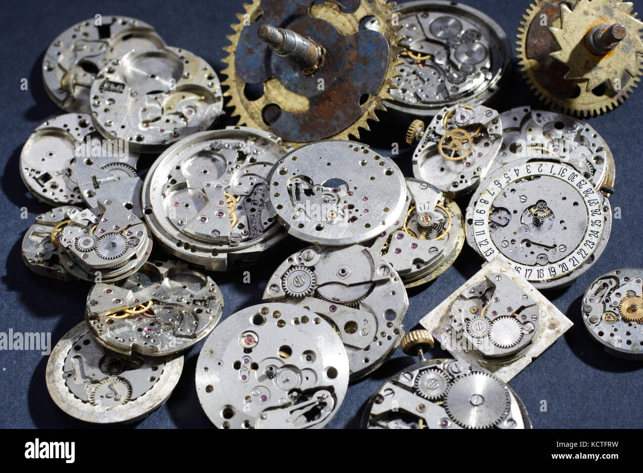 broken mechanical watches background Stock Photo - Alamy