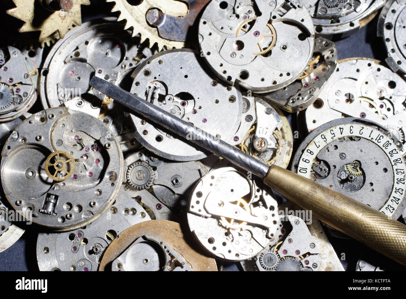 broken mechanical watches background Stock Photo - Alamy