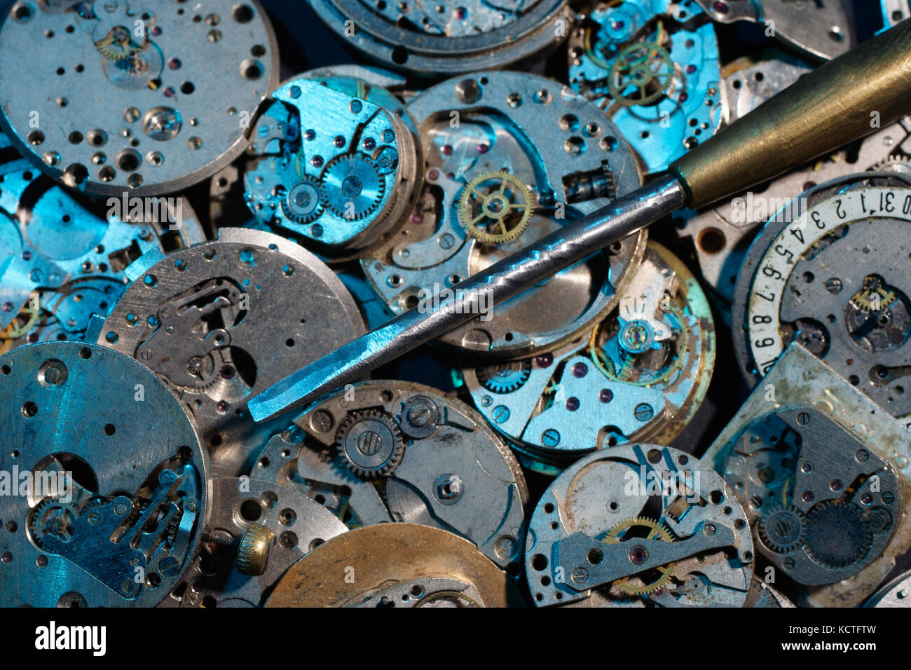 broken mechanical watches background Stock Photo - Alamy