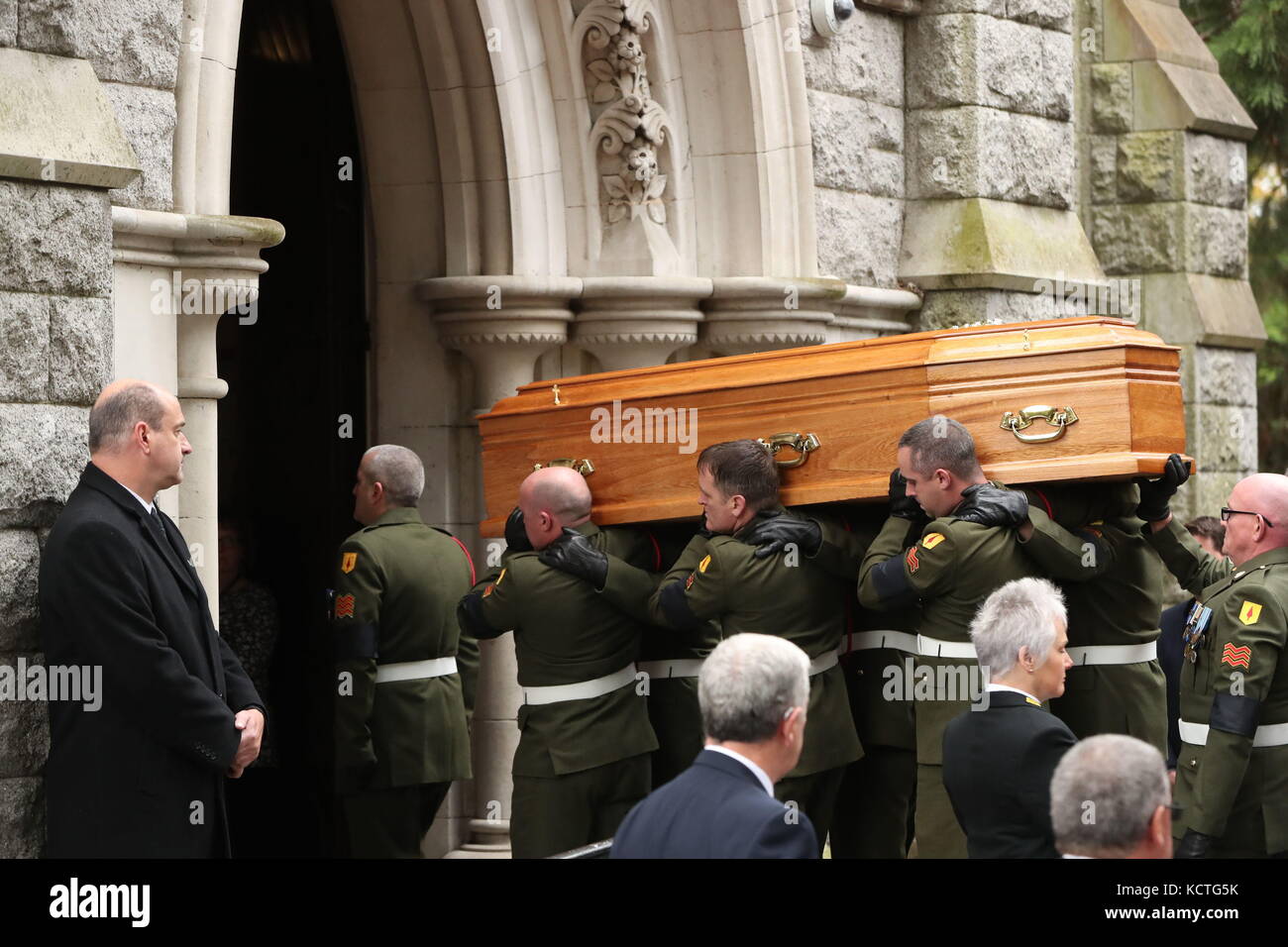 The coffin of former Irish taoiseach Liam Cosgrave is carried into the ...