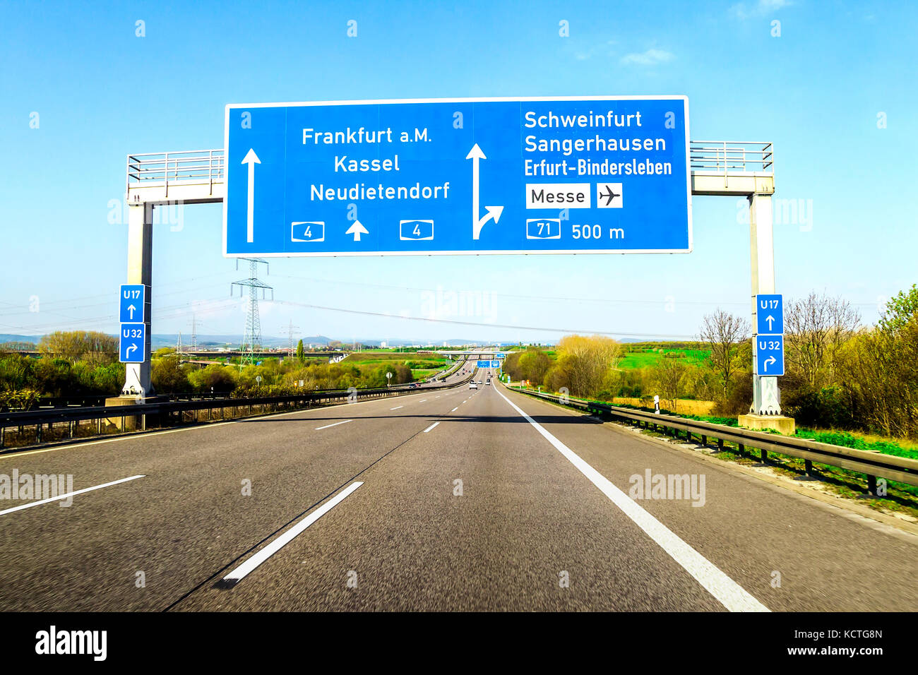 Blue freeway sign over the road in Germany on sunny day Stock Photo - Alamy