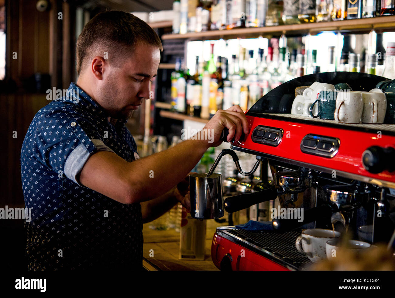 bartender serving coffee Stock Photo - Alamy
