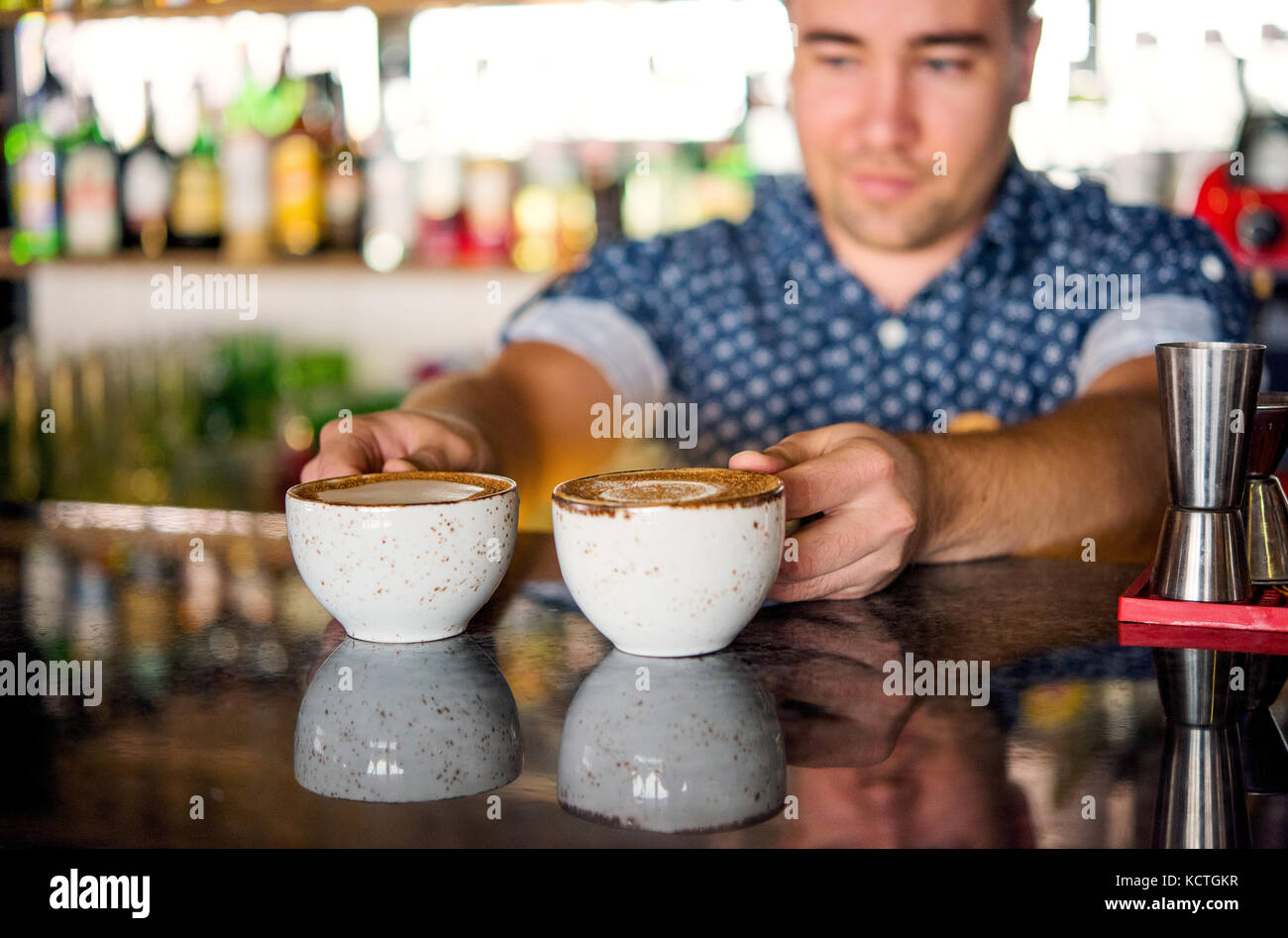 bartender serving coffee Stock Photo - Alamy