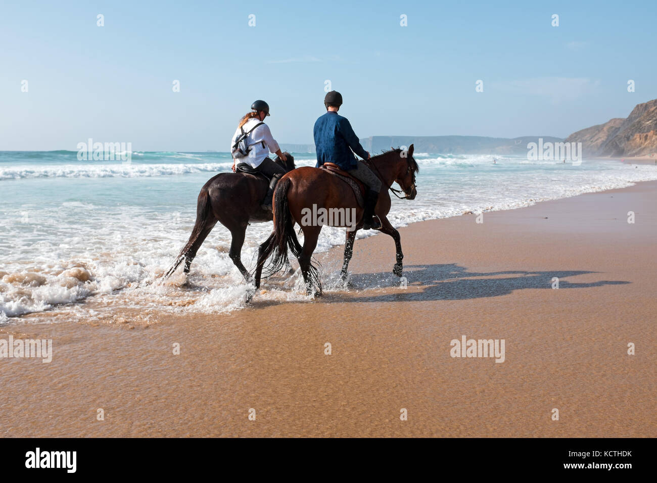 Horse riding at the beach at the atlantic ocean Stock Photo - Alamy