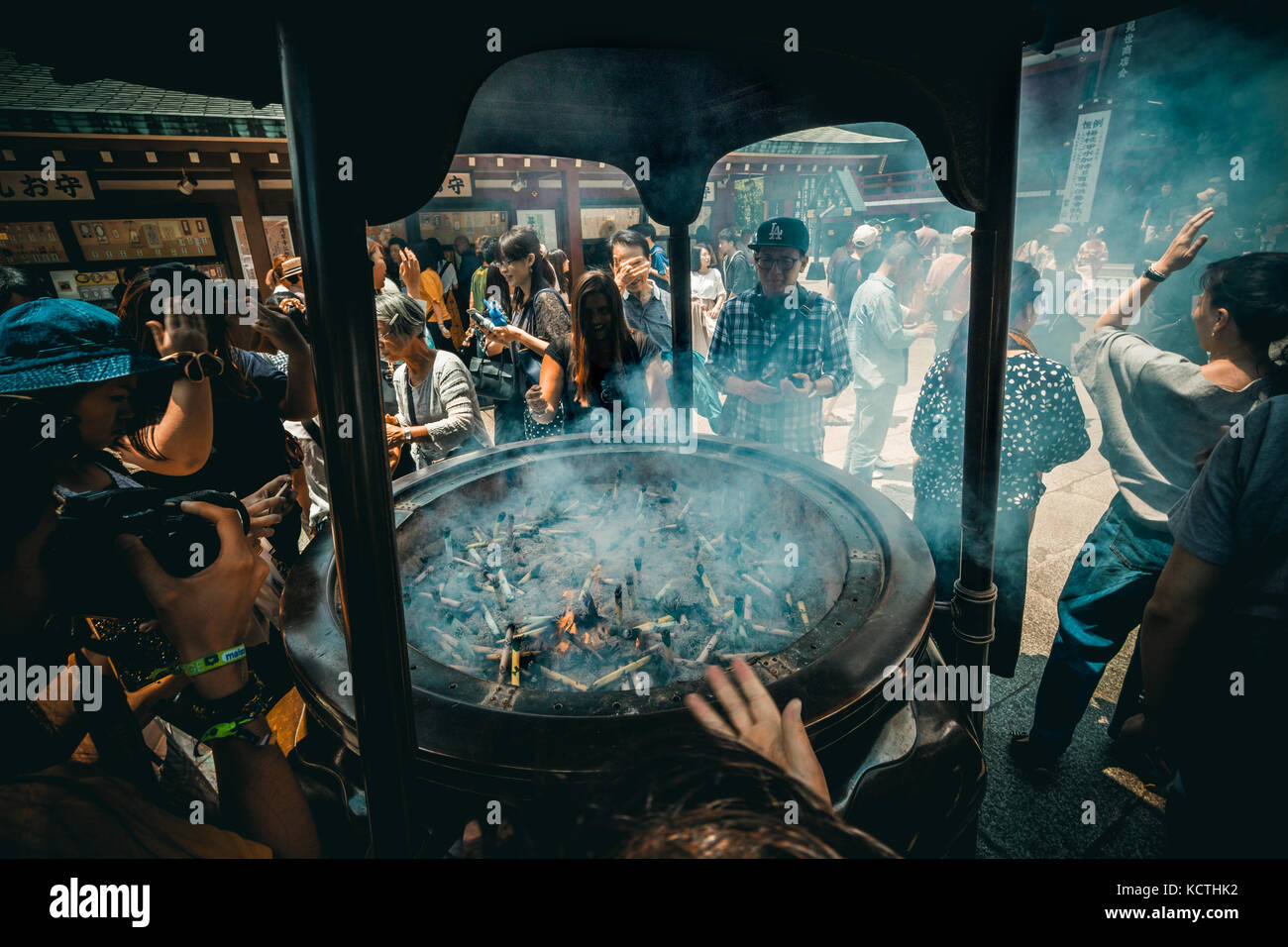 Breathing smoke in Akakusa temple, Tokyo Stock Photo - Alamy