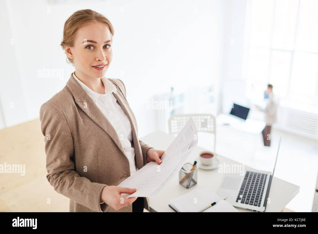 Accountant with papers Stock Photo - Alamy