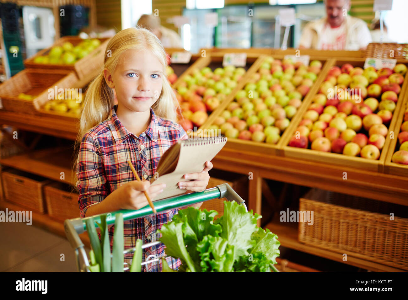 Girl with shopping list Stock Photo - Alamy