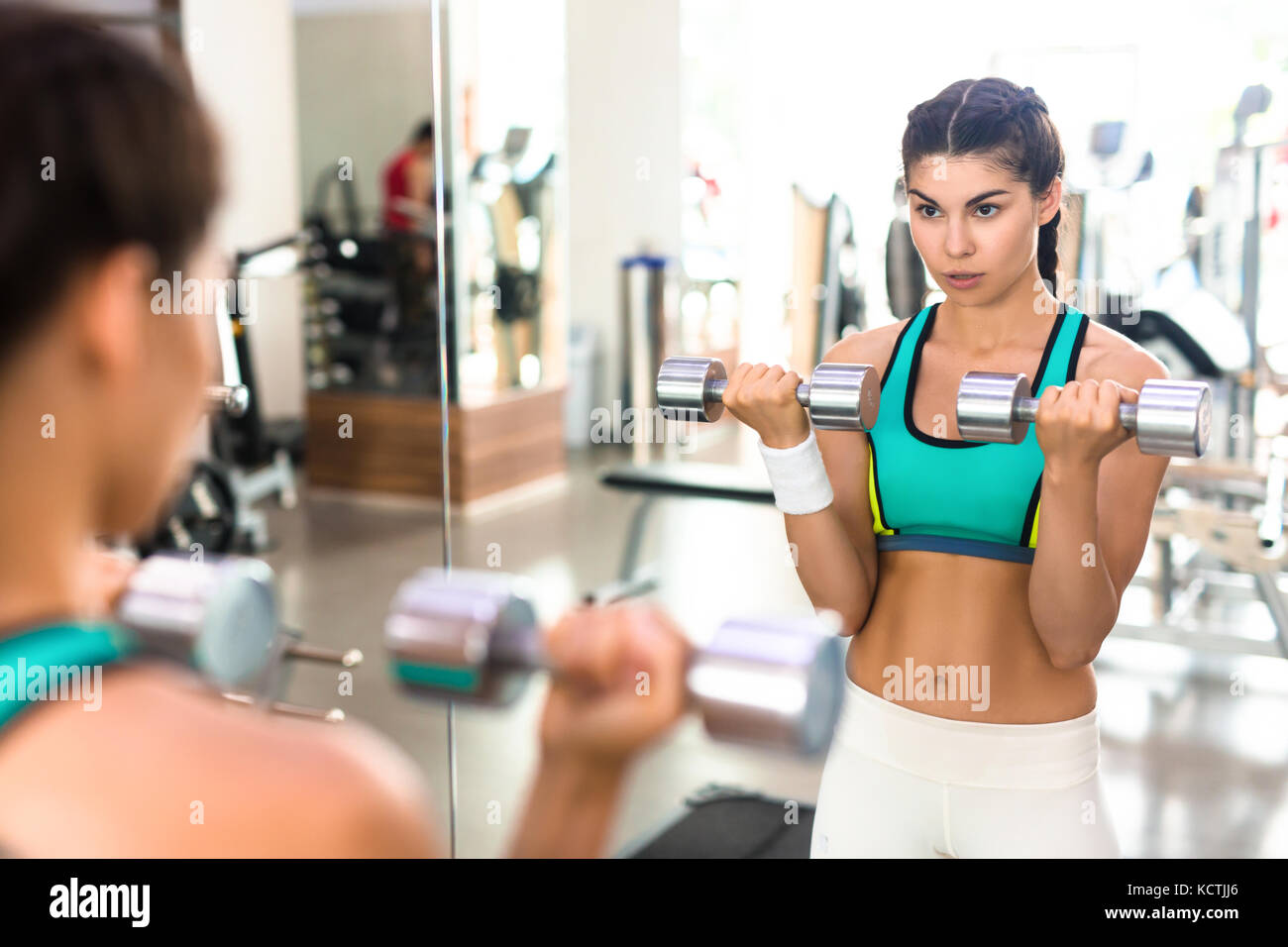 Woman exercising in front of mirror hi-res stock photography and images ...
