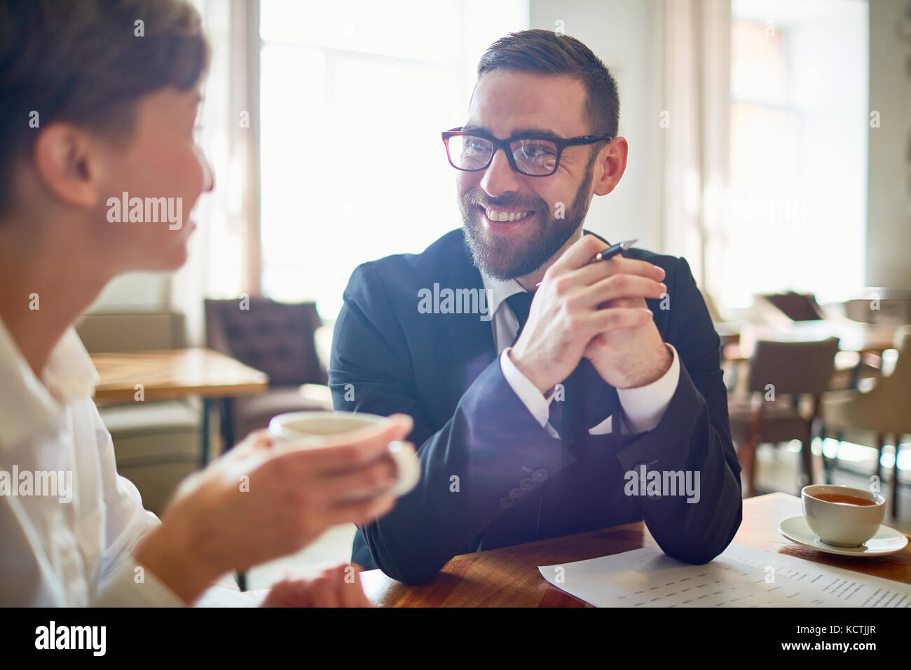 Discussion by cup of tea Stock Photo - Alamy