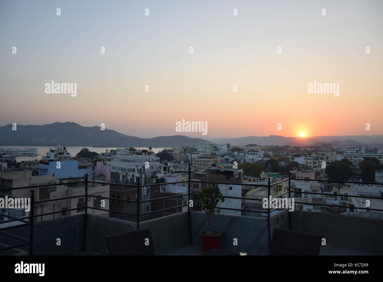 Aerial view of the city of Udaipur at sunset from a terrace, Rajasthan ...