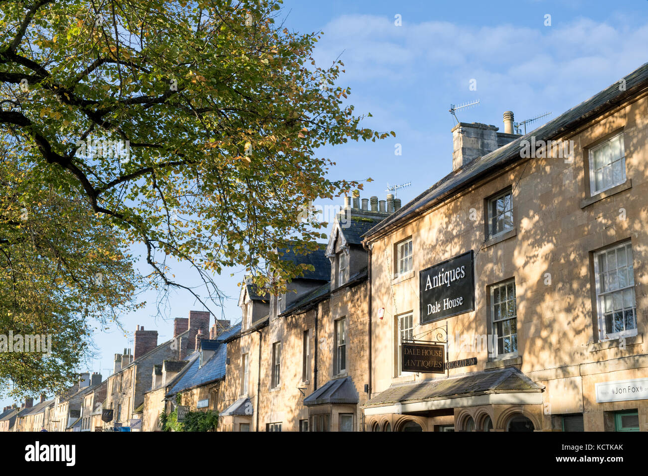 Moreton in Marsh high street with the trees changing colour in autumn ...