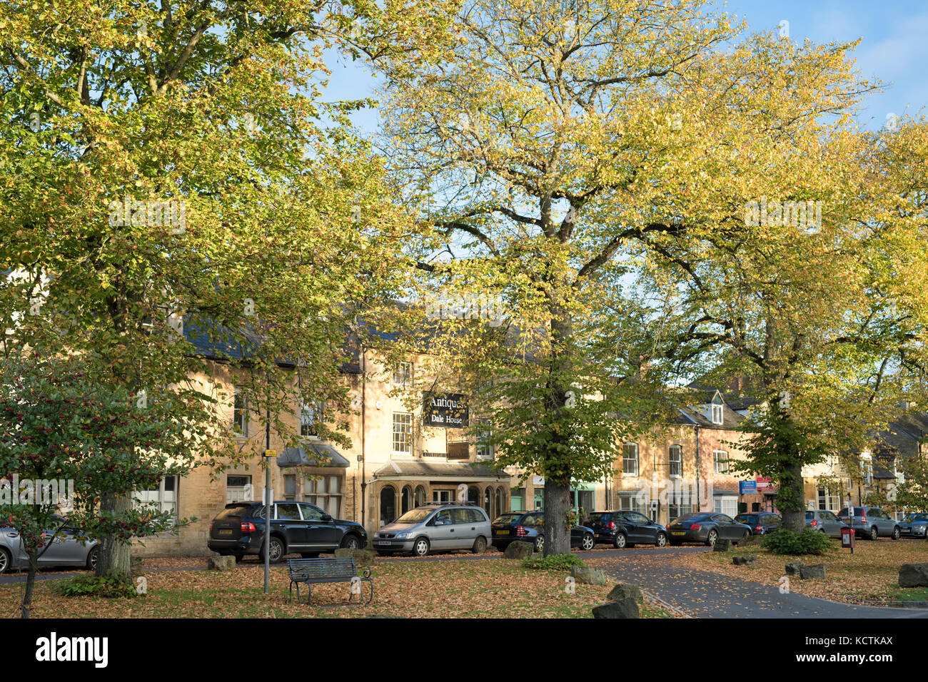 Moreton in Marsh high street with the trees changing colour in autumn ...