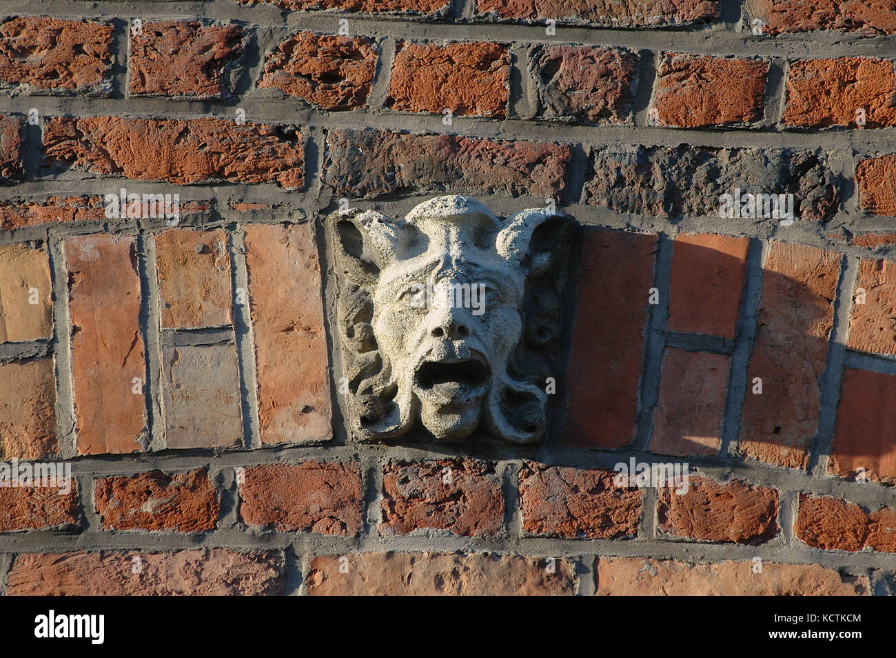 Ornate keystone in a brick window arch Stock Photo - Alamy