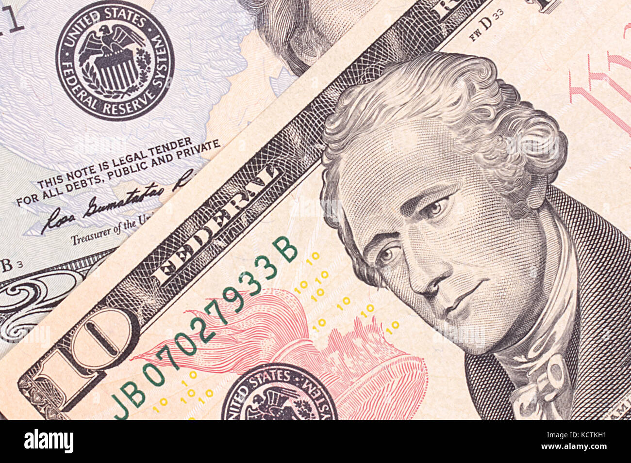 Alexander Hamilton face on US ten money background Stock Photo - Alamy
