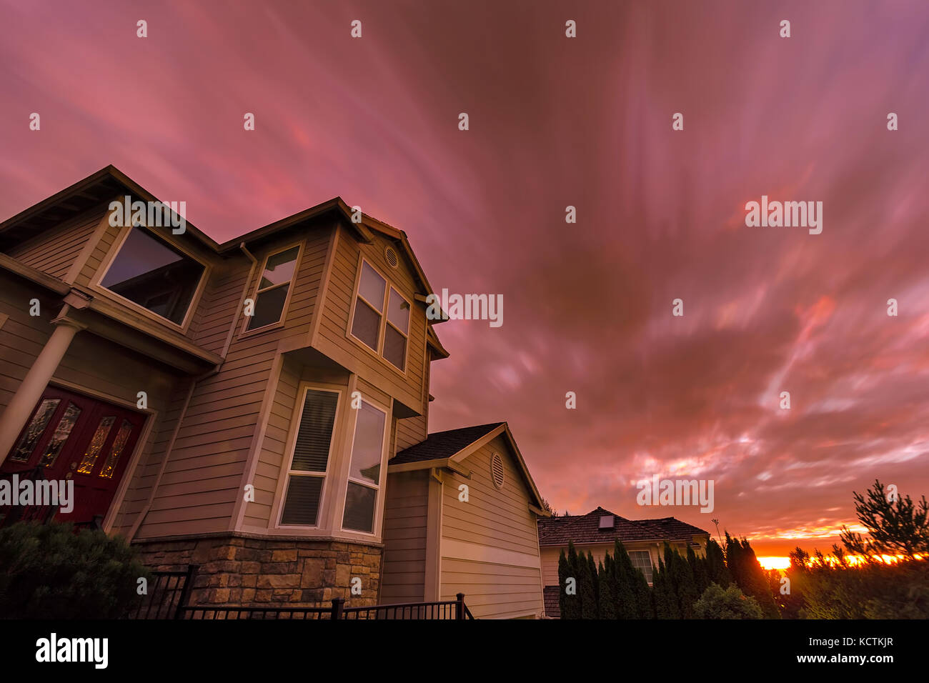 Sunset in North American suburbs neighborhood homes long exposure sky ...