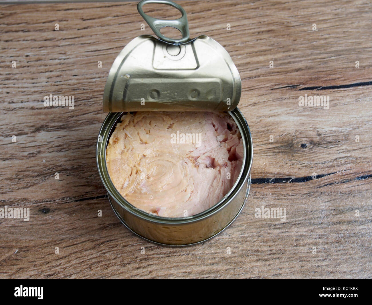 Tuna canned on wood background Stock Photo - Alamy