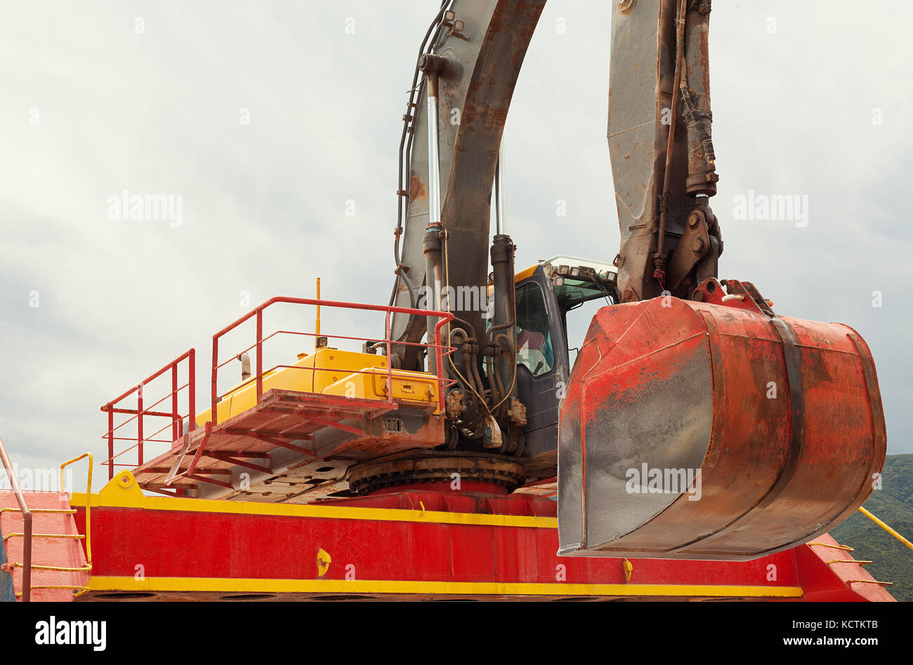 Big colorful excavator of sea tanker, closeup view Stock Photo - Alamy