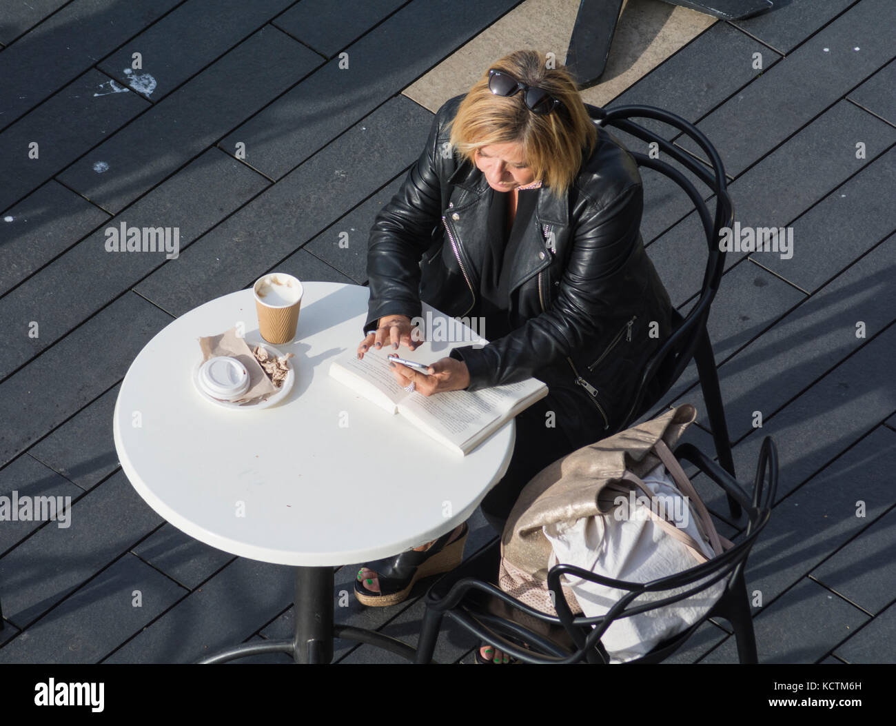 A woman testing at a table outside the Royal Festival Hall, South Bank ...