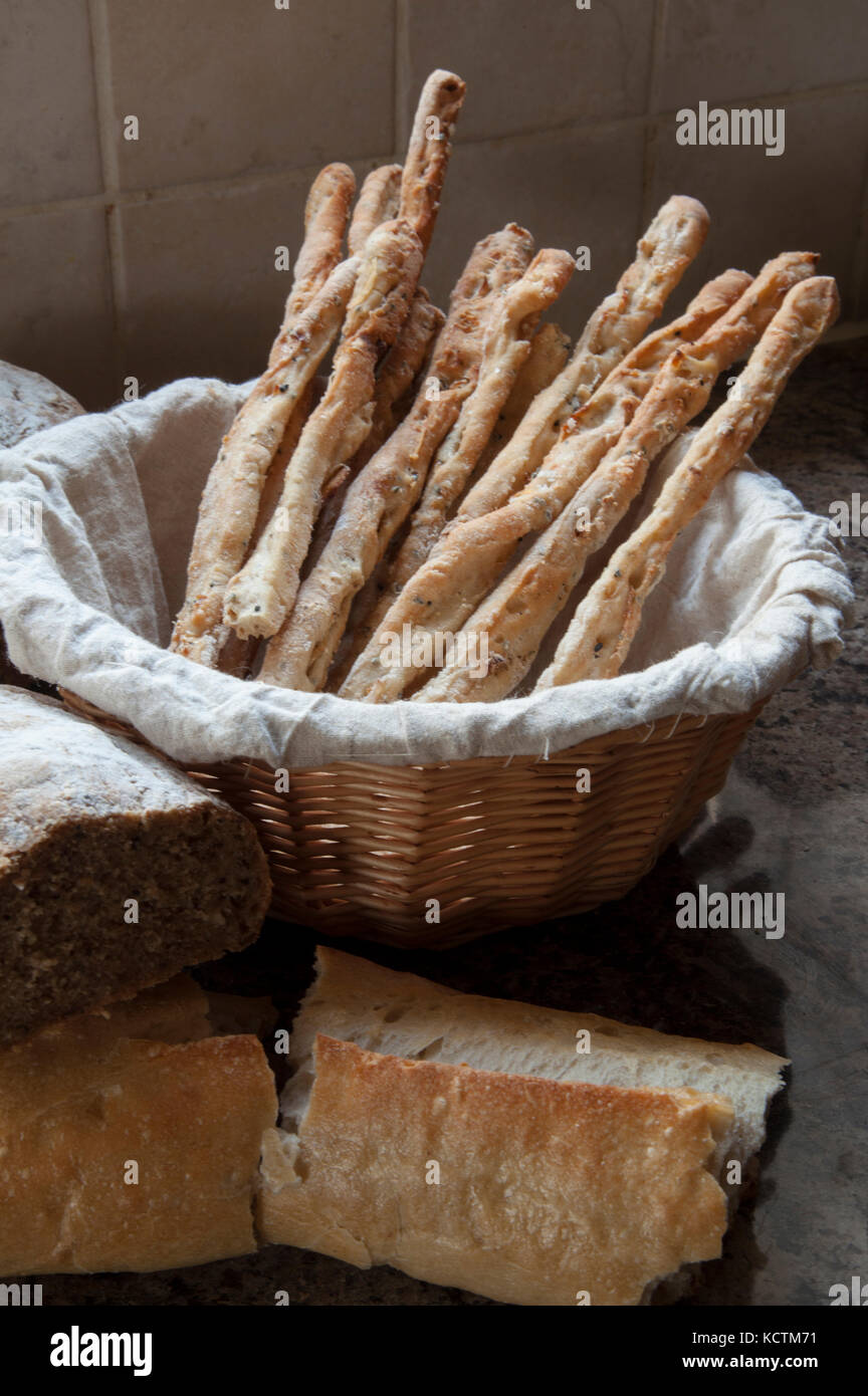 Home made bread sticks in a basket Stock Photo - Alamy