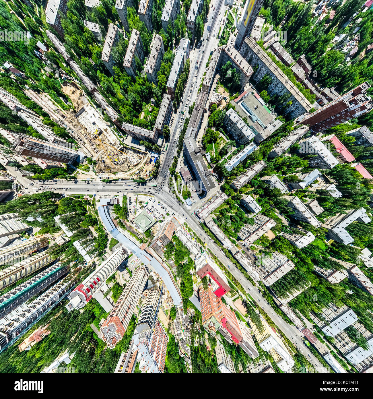 Aerial city view with crossroads and roads, houses, buildings, parks ...